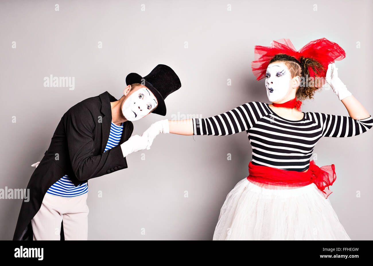 portrait of mimes in love. man kissing womans hand Stock Photo - Alamy