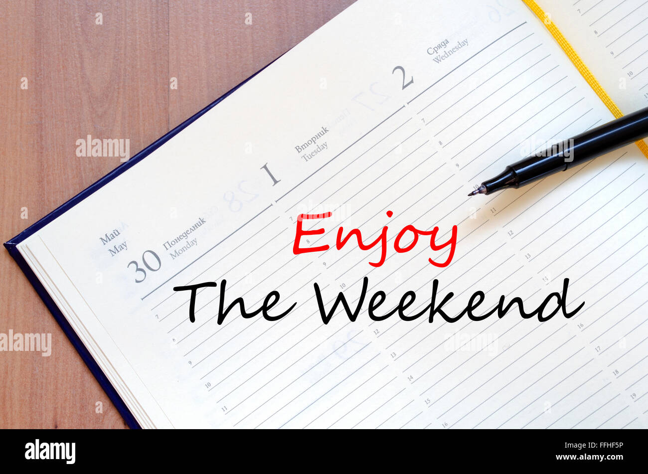 Enjoy the weekend text concept write on notebook Stock Photo - Alamy