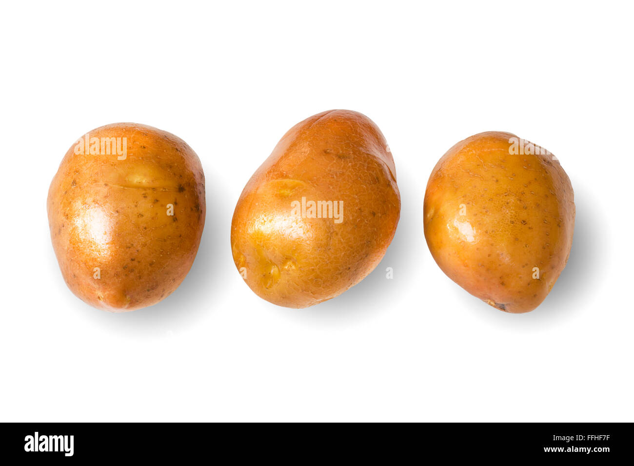 Three potato isolated Stock Photo - Alamy