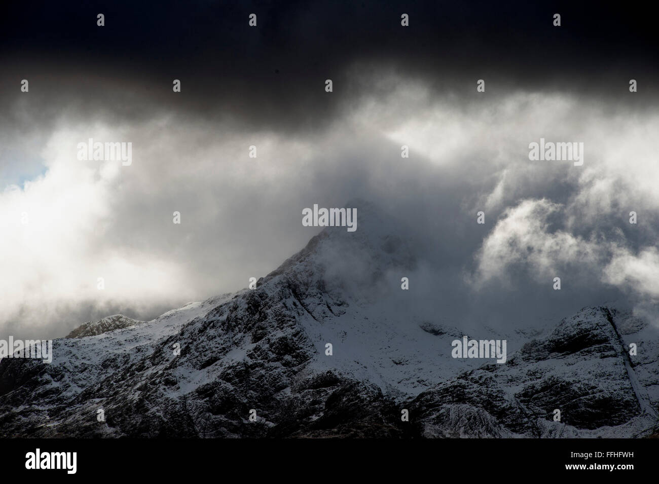 Snow topped peaks of the Black Cuillin Ridge on the Isle of Skye in ...
