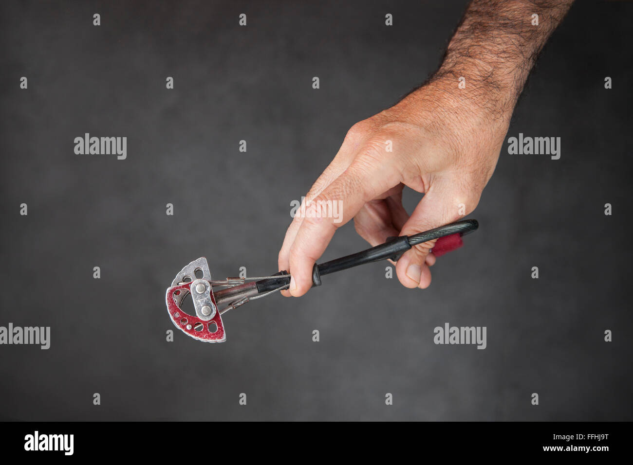 Close up view of a hand using climbing friend, also known as spring ...