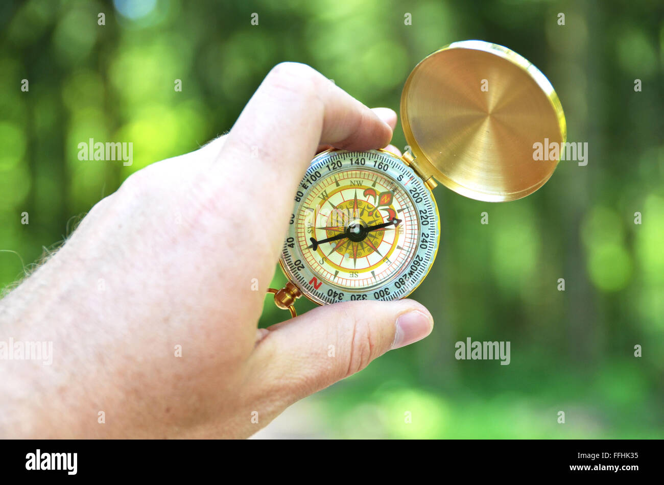 Compass in the hand Stock Photo - Alamy
