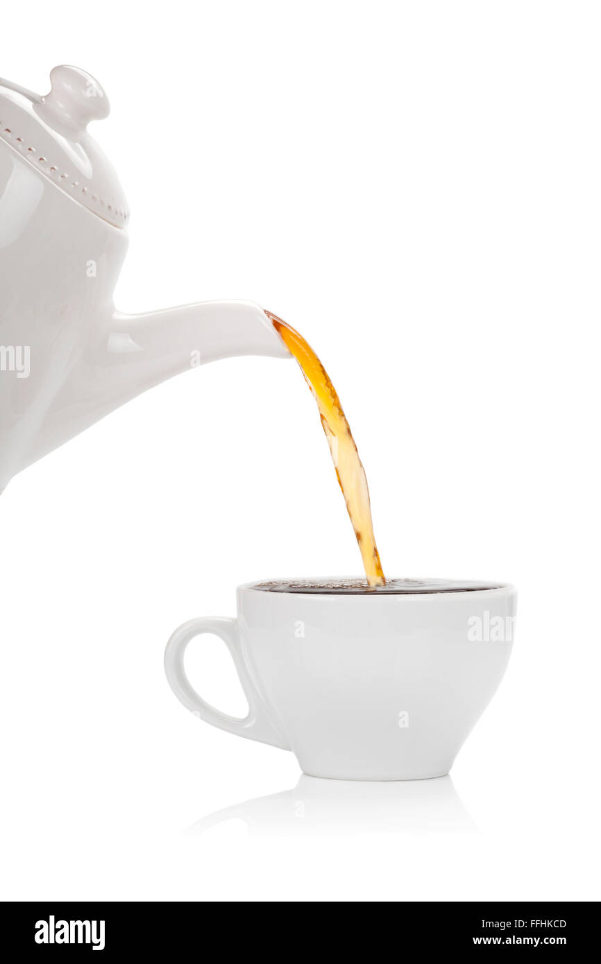 Pouring tea into a cup isolated on white background Stock Photo - Alamy
