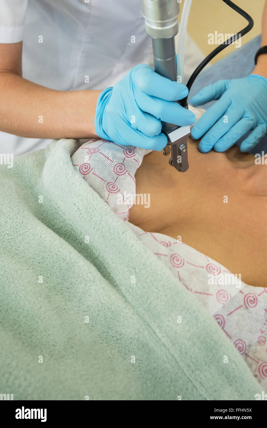 fractional laser rejuvenation of neckline area for women Stock Photo ...