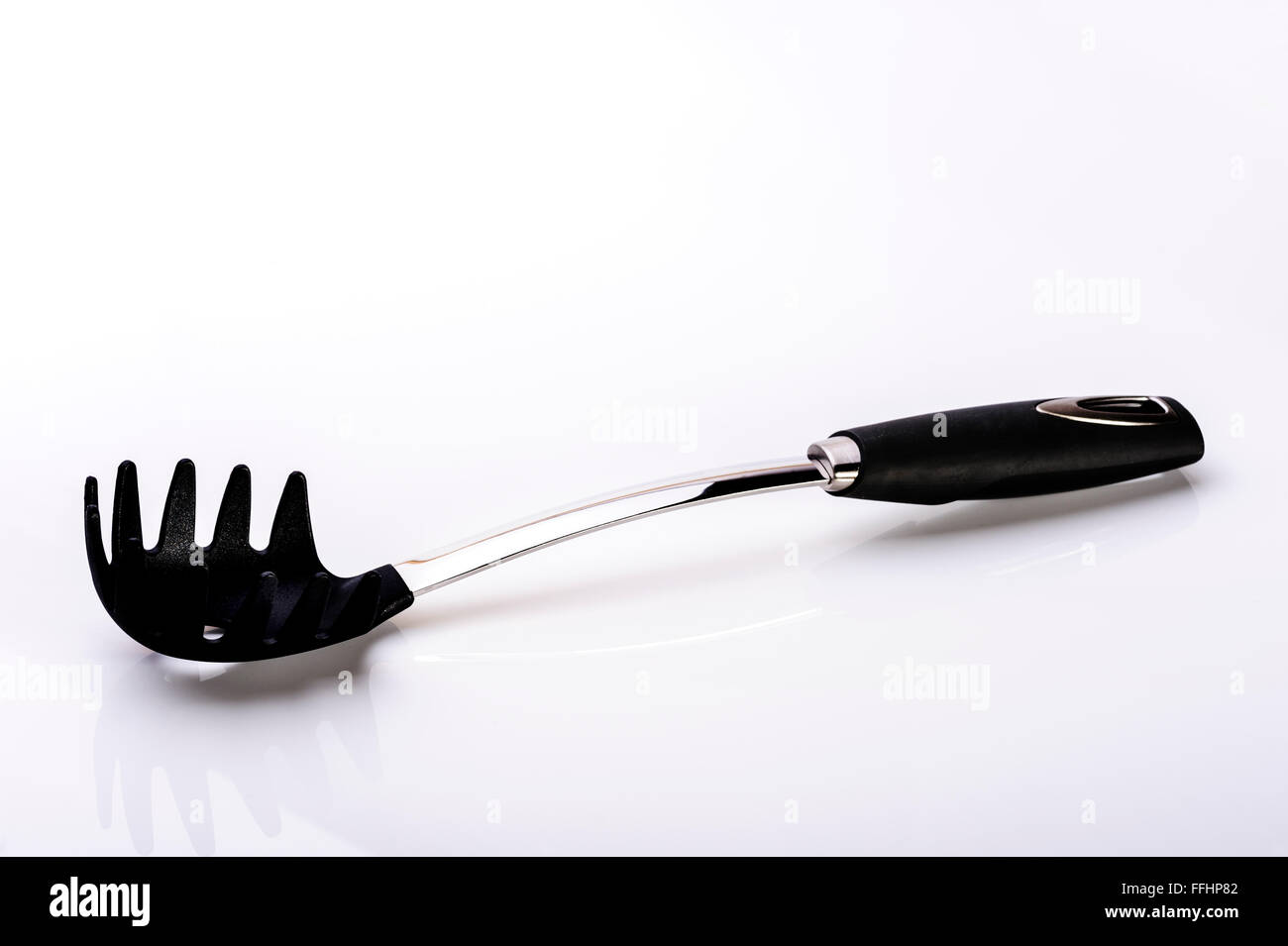 Spaghetti or pasta scoop.Kitchen equipment untensil Stock Photo - Alamy