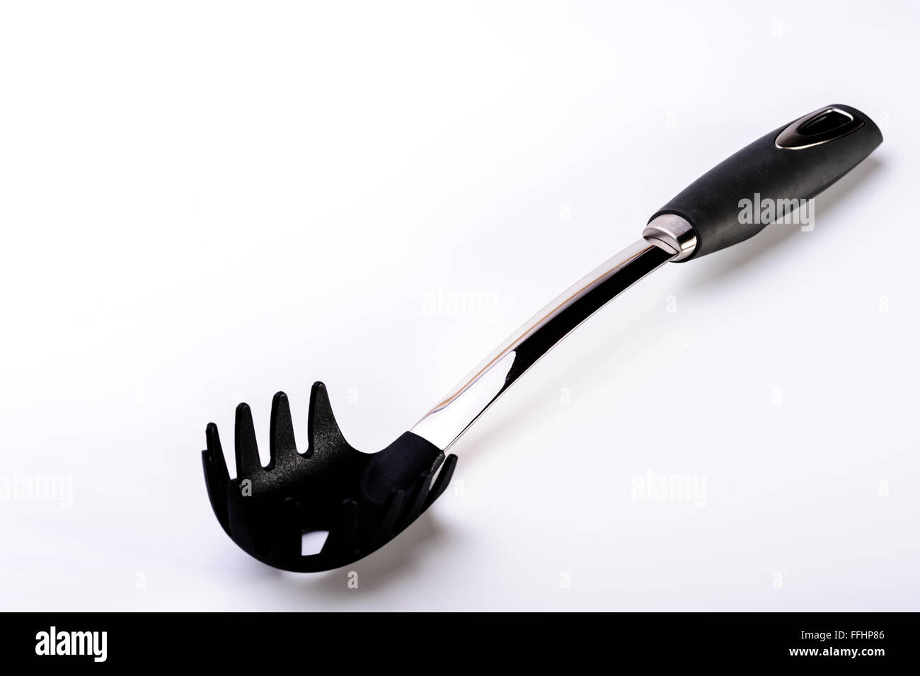 Spaghetti or pasta scoop.Kitchen equipment untensil Stock Photo - Alamy
