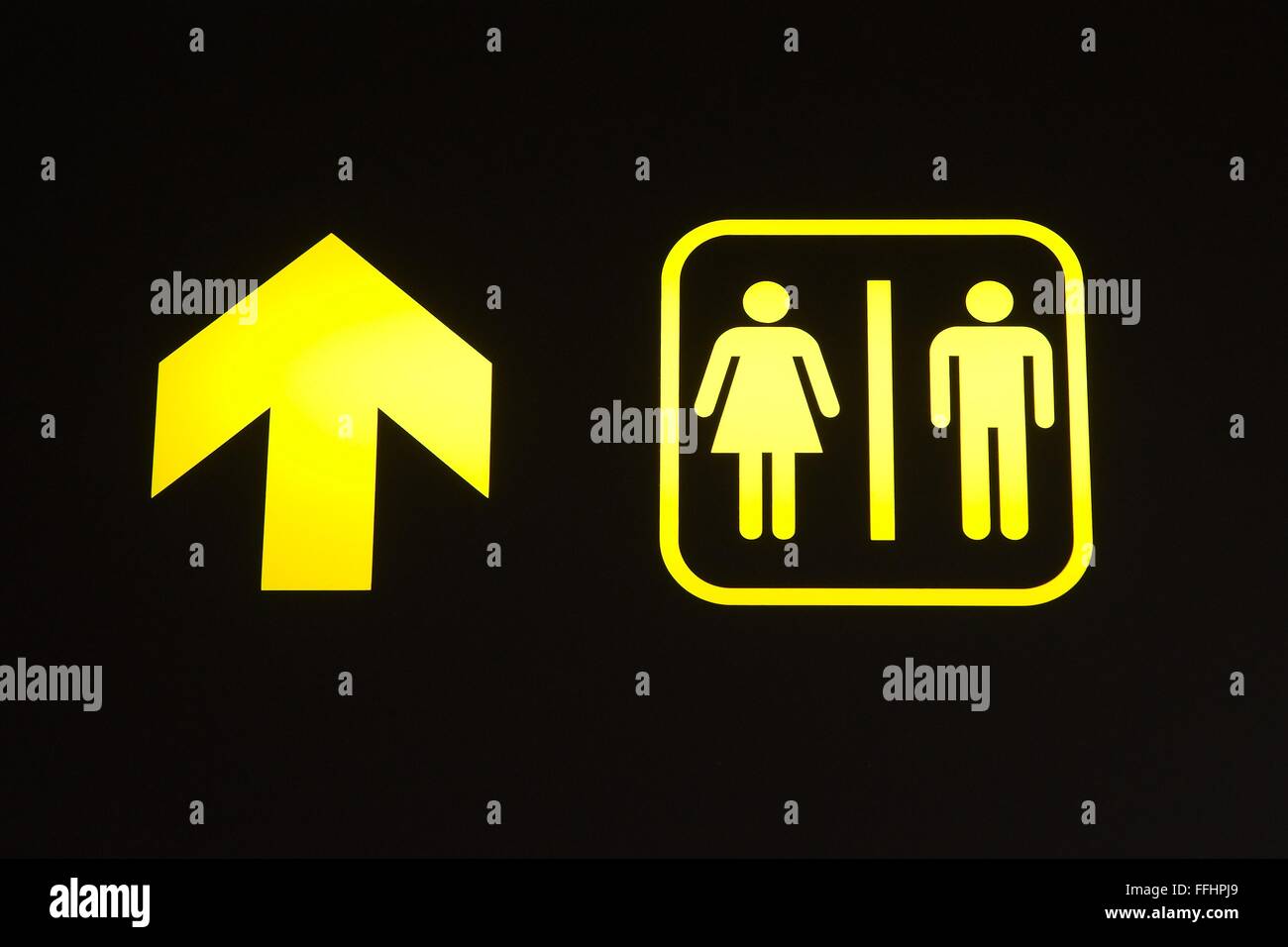 Toilet sign with arrow Stock Photo - Alamy