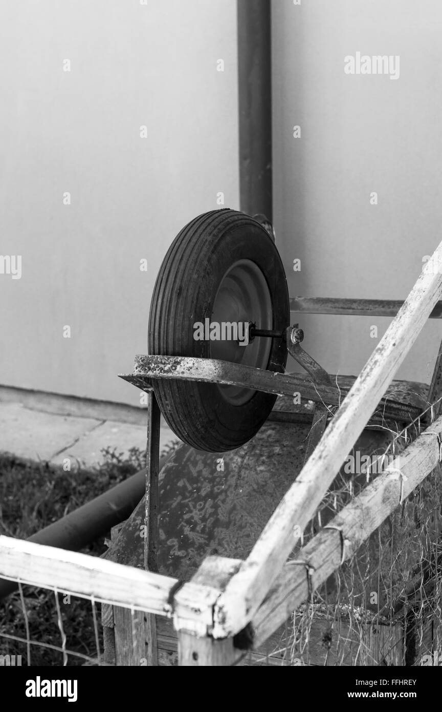 Wheel barrow overturned Stock Photo - Alamy