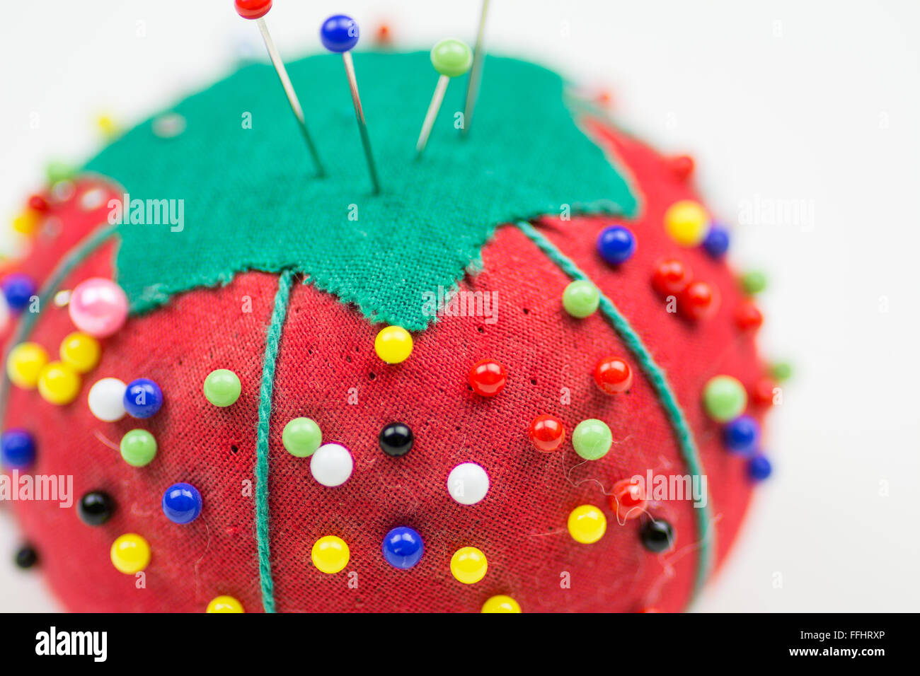 Isolated tomato pin cushion Stock Photo - Alamy