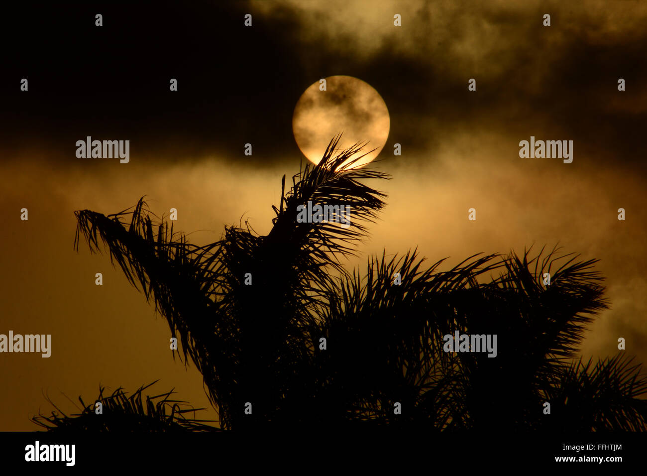 Sun with dark clouds hi-res stock photography and images - Alamy