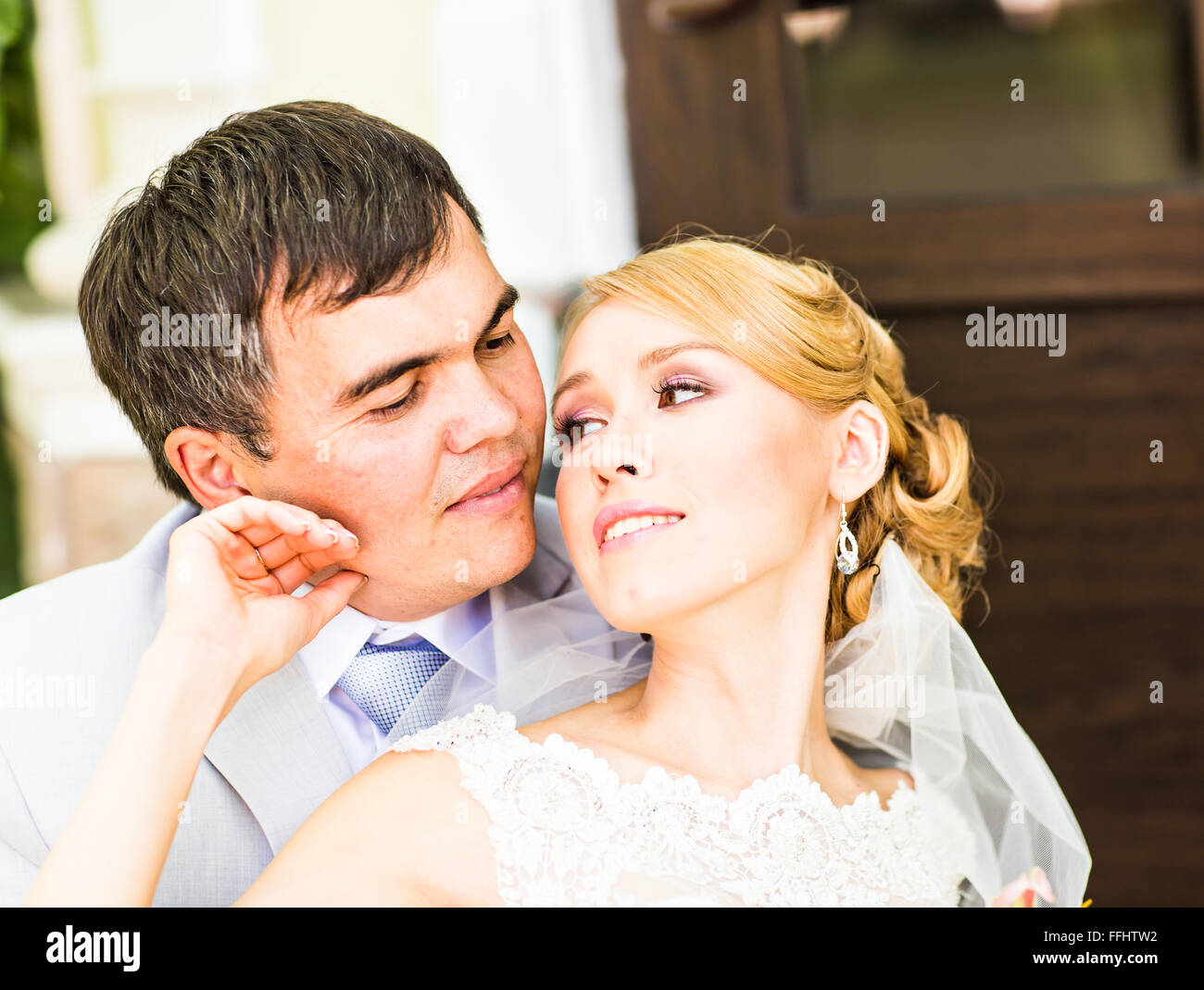 Young wedding couple enjoying romantic moments Stock Photo - Alamy