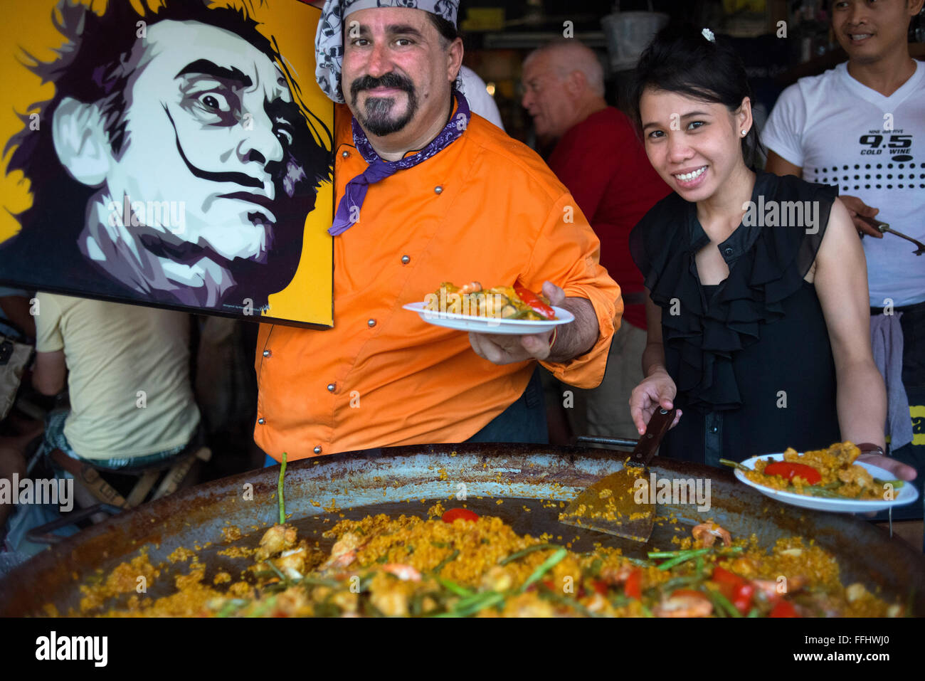 Viva 8 chef Fernando Andrés Yusta posing near sea food paella pan ...