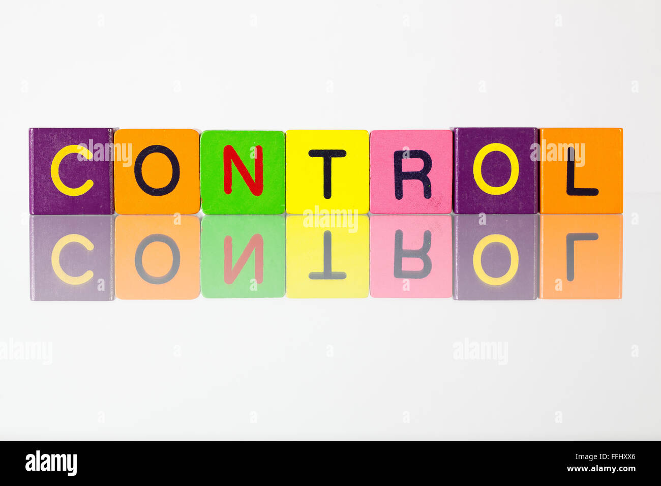 Control - an inscription from children's wooden blocks Stock Photo - Alamy