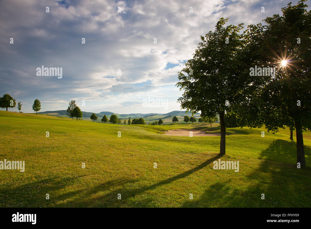 On a empty golf course at sunset Stock Photo - Alamy