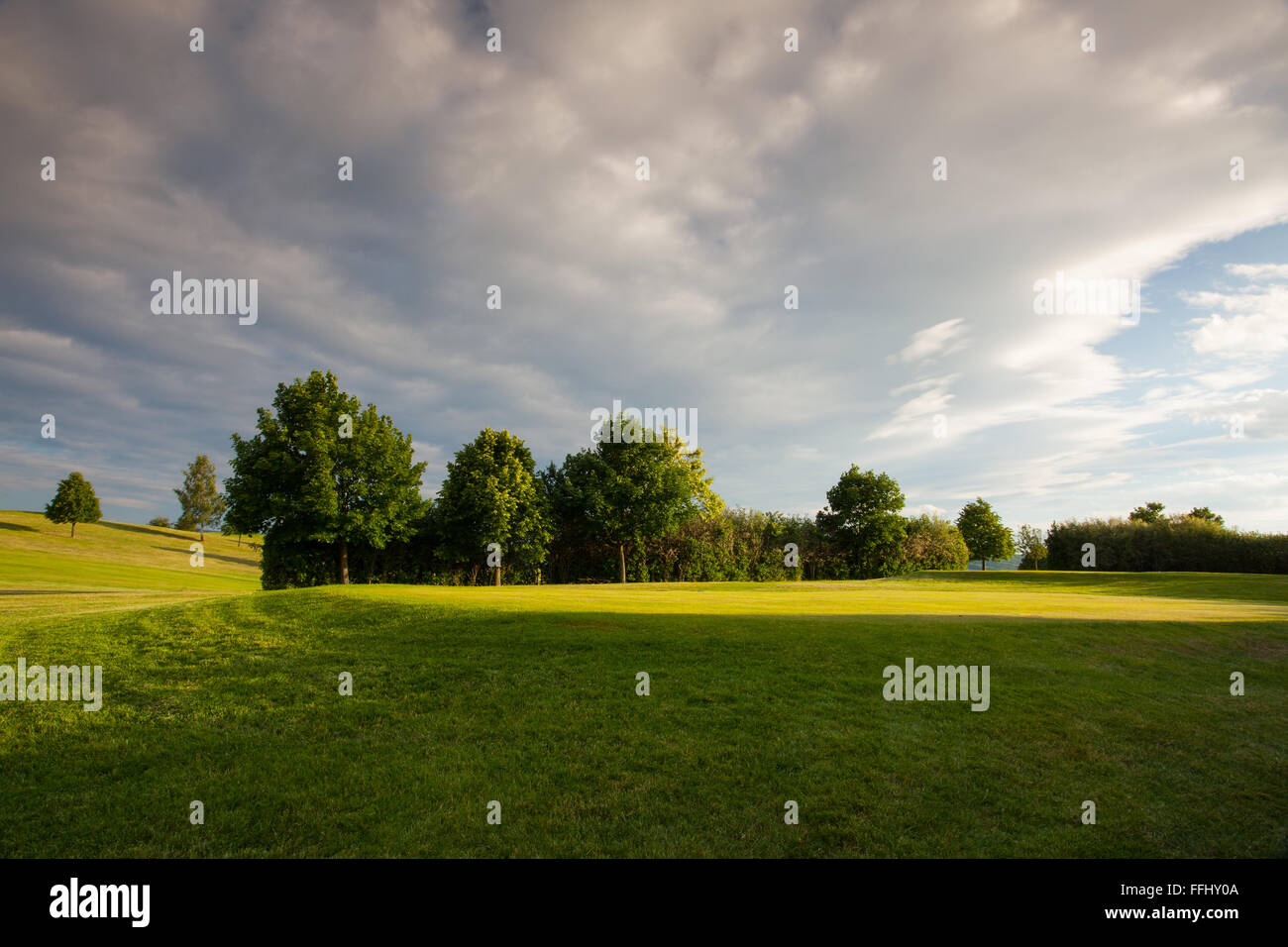 On a empty golf tee at sunset Stock Photo - Alamy