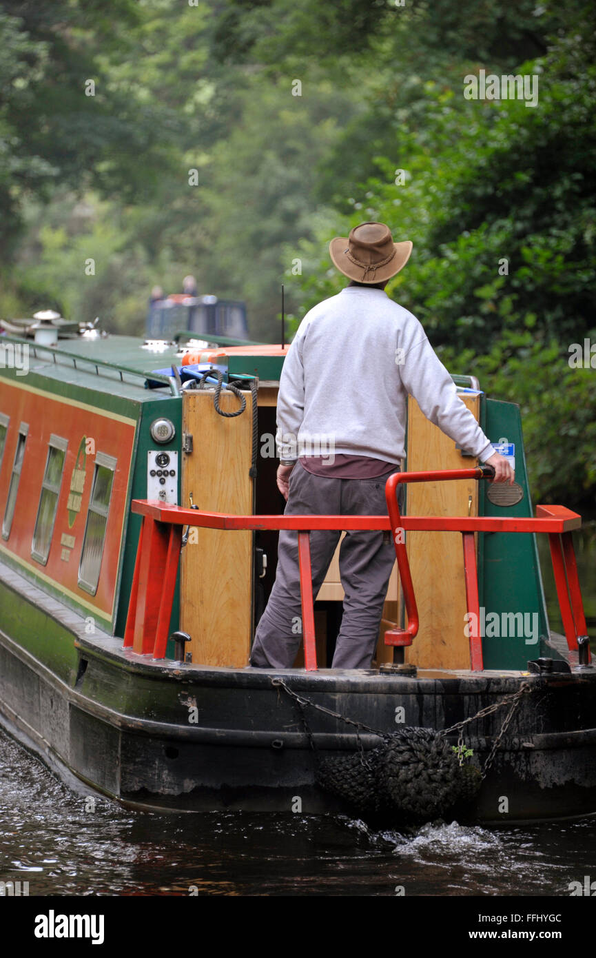 Man navigating a narrow boat on the Llangollen Canal in Wales, UK Stock ...