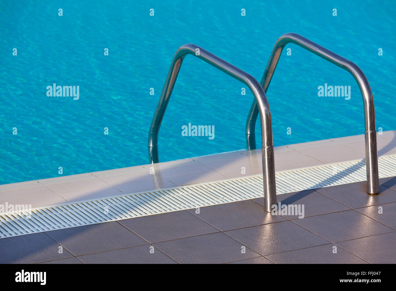 Ladder of a swimming pool. Horizontal shot Stock Photo - Alamy
