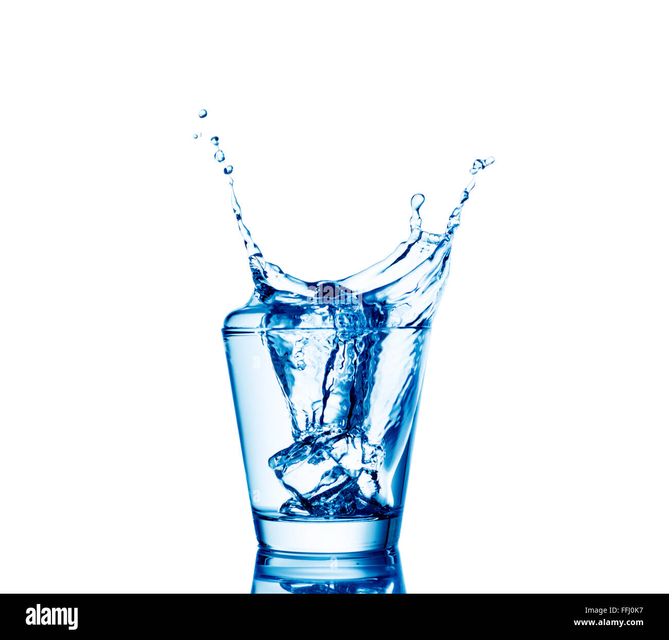 Ice cubes splashing into glass of water, isolated on white Stock Photo - Alamy