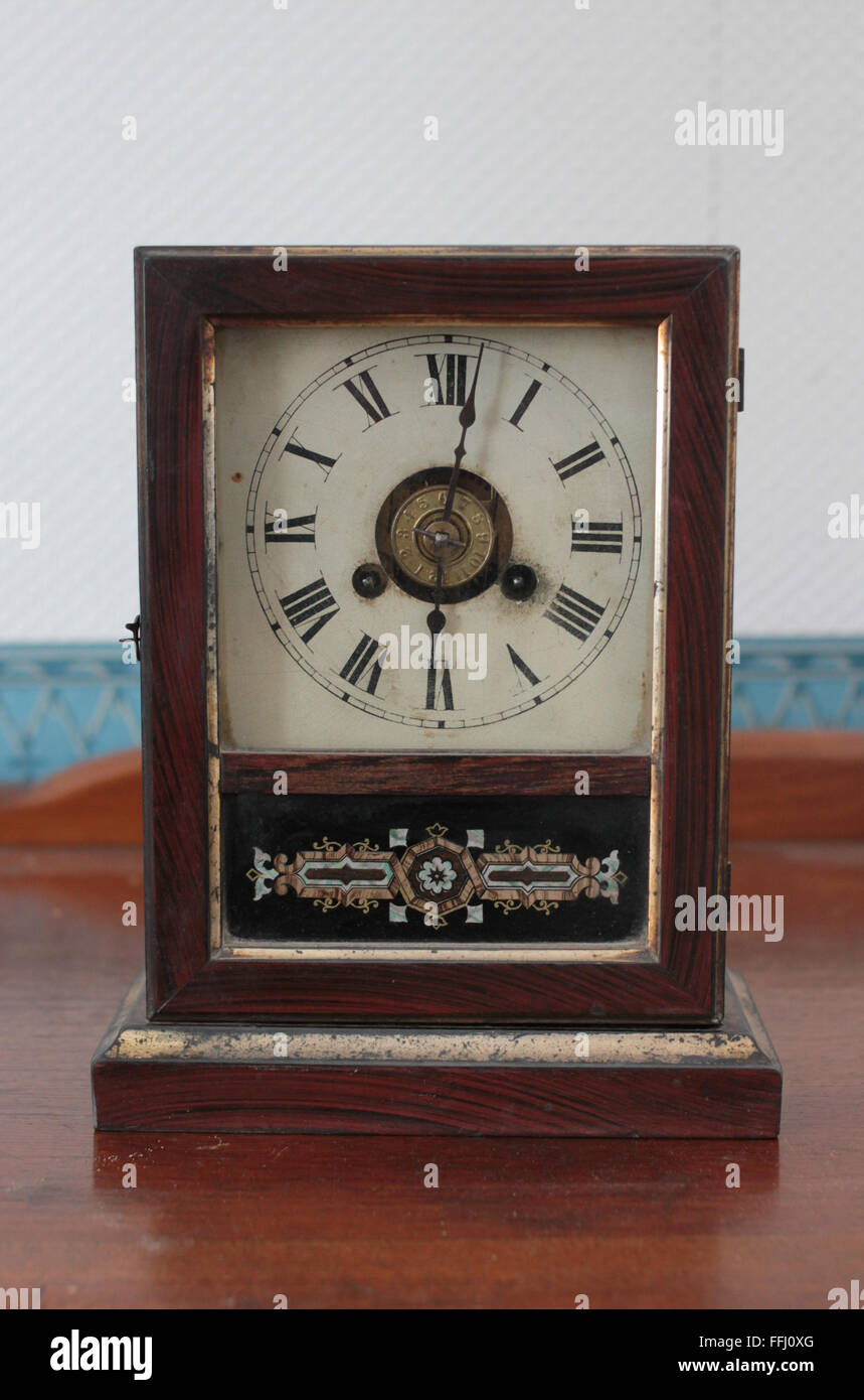 Decorative wooden mantle clock Stock Photo - Alamy