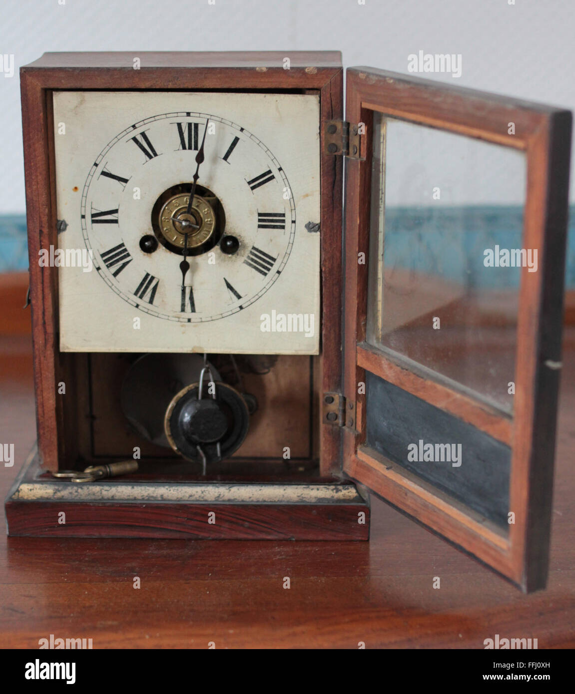 Decorative mantle clock with door and key Stock Photo - Alamy