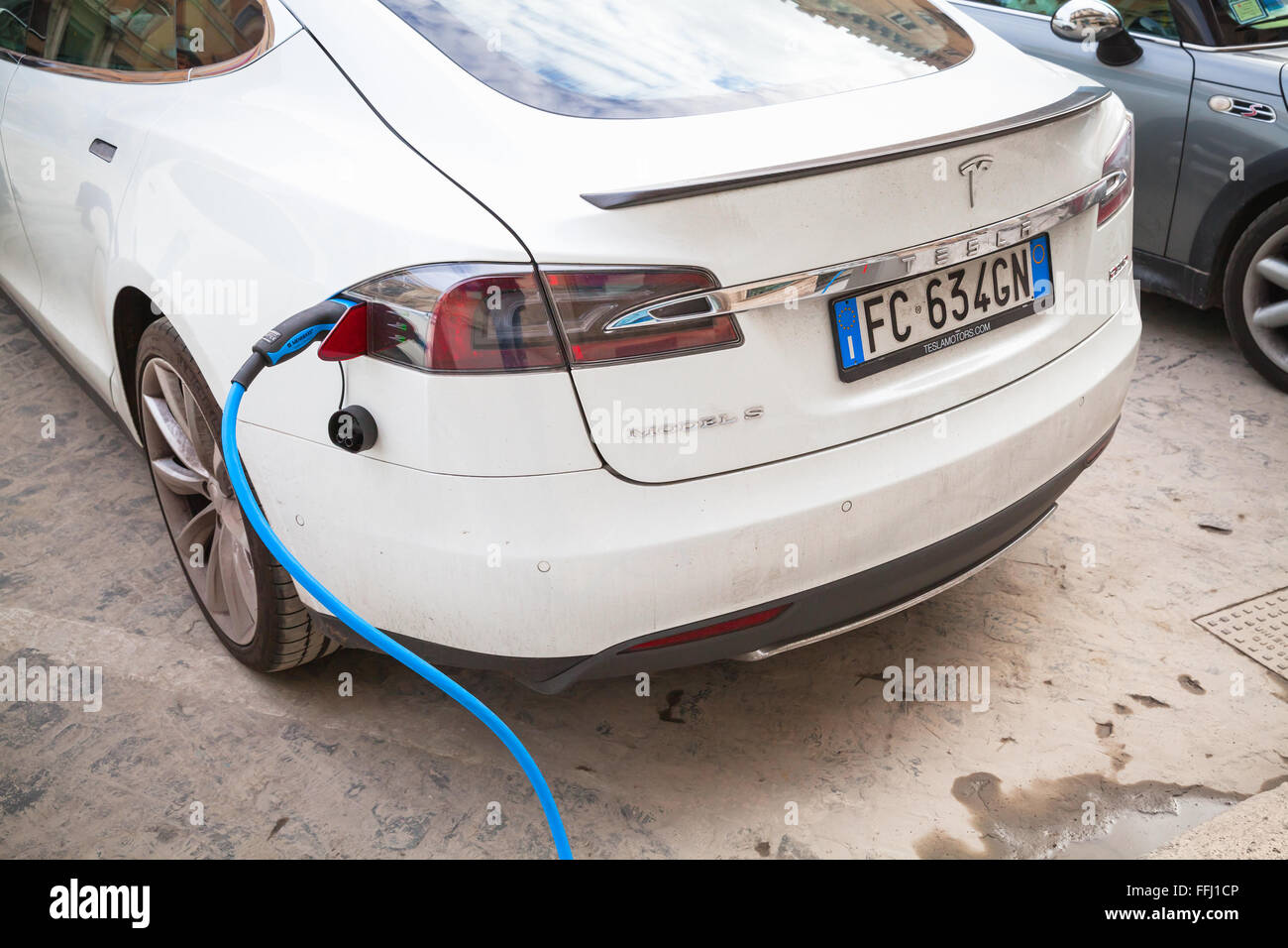 Rome, Italy - February 13, 2016 : White Tesla model S car charging at ...