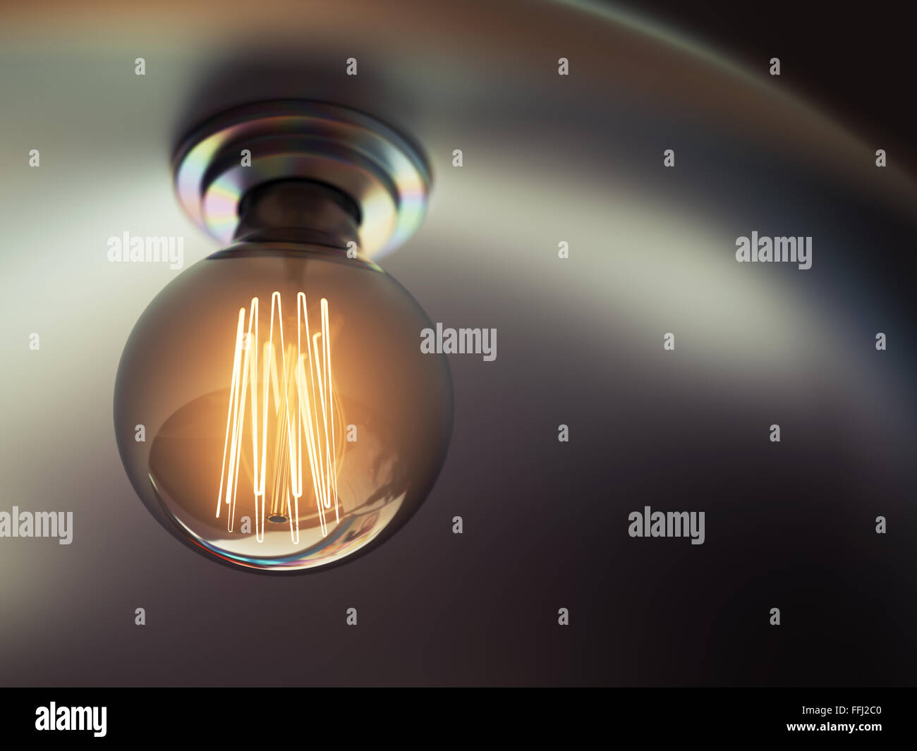 Glowing old-fashioned light bulb with aluminum cover Stock Photo - Alamy
