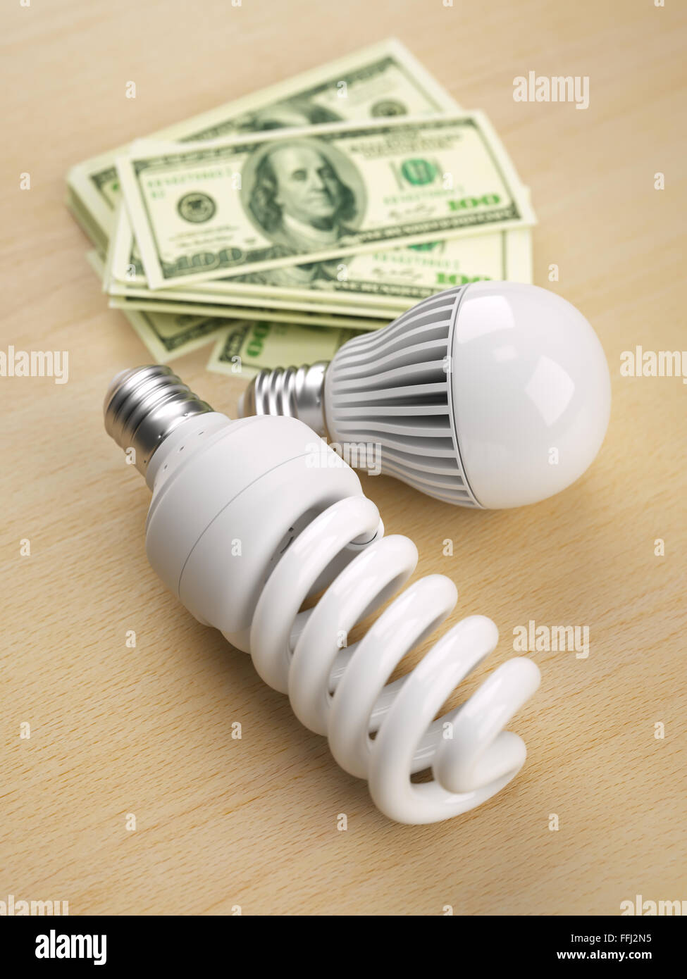 CFB and LED lamps in front of one hundred dollar bill stack Stock Photo ...