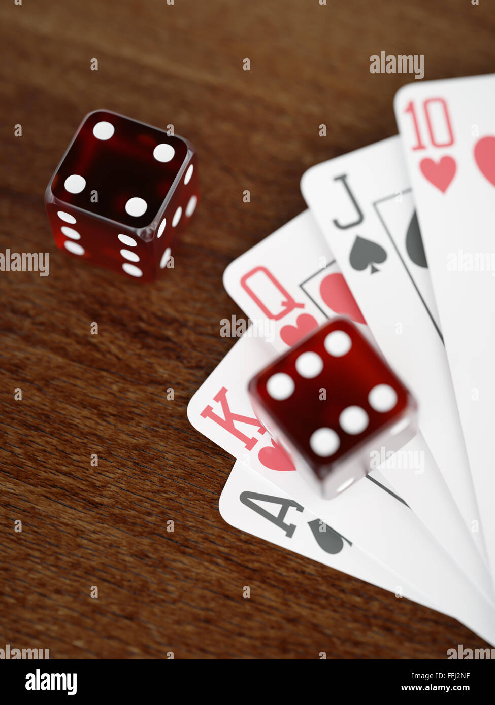 Playing cards and dice on wooden table close-up Stock Photo - Alamy