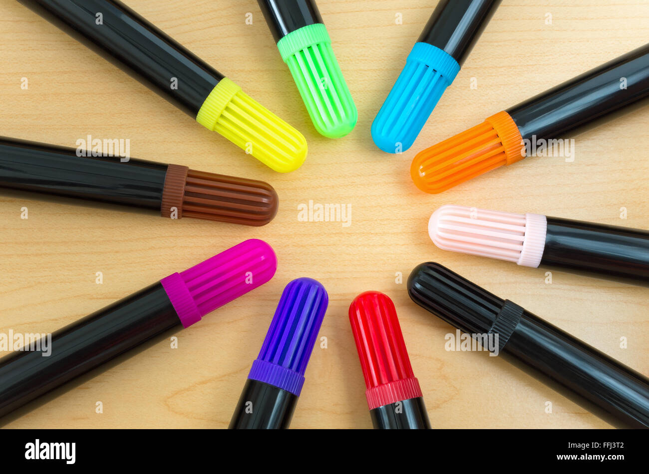 studio still life abstract of circle of art markers closeup in radial ...