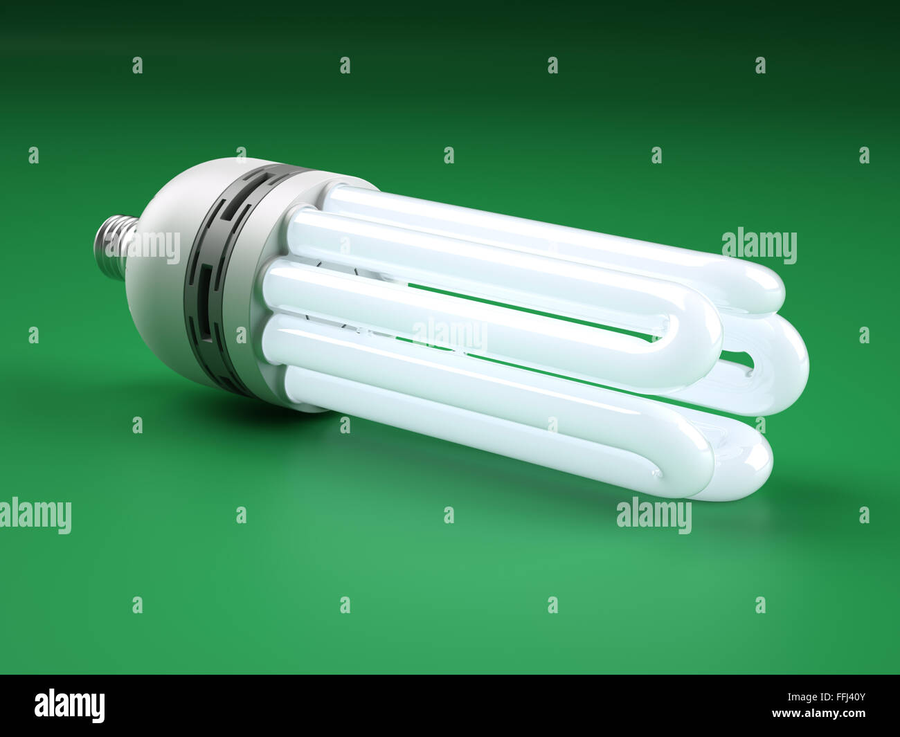 Big powerful compact fluorescent lightbulb on green background Stock ...