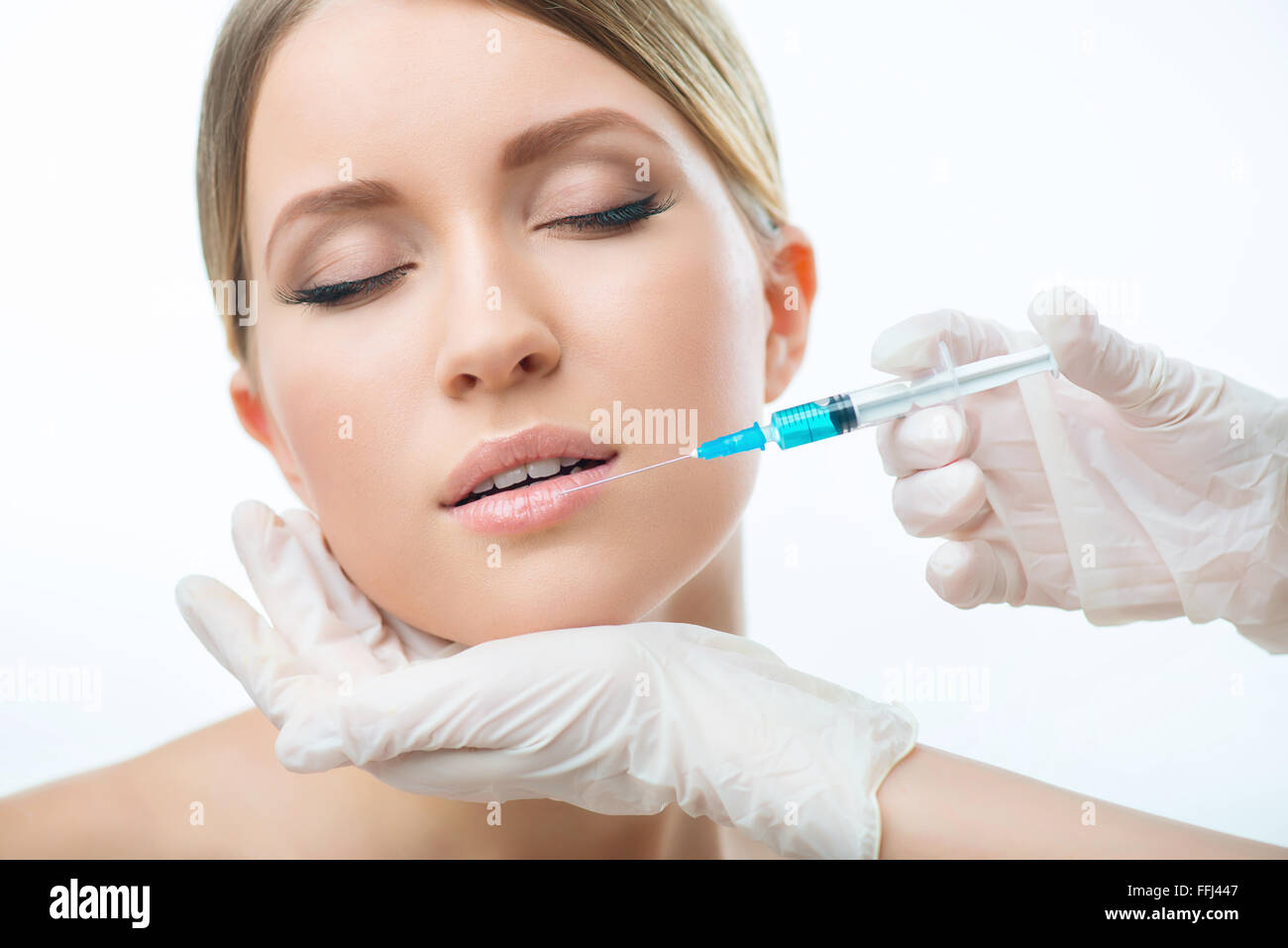 Professional cosmetologist making injections Stock Photo - Alamy