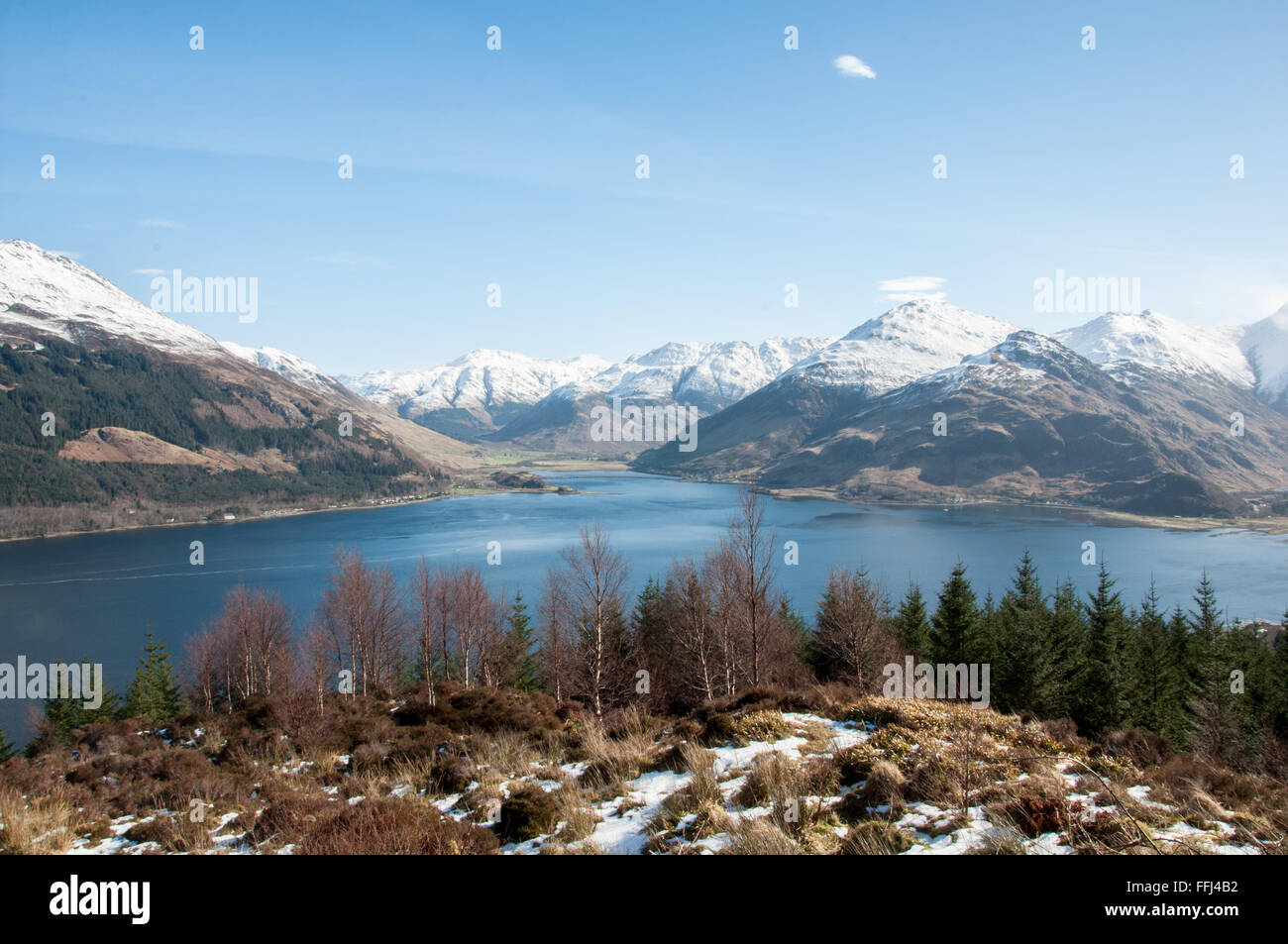 Loch Duich below the snow covered mountains of Five Sisters of Kintail ...