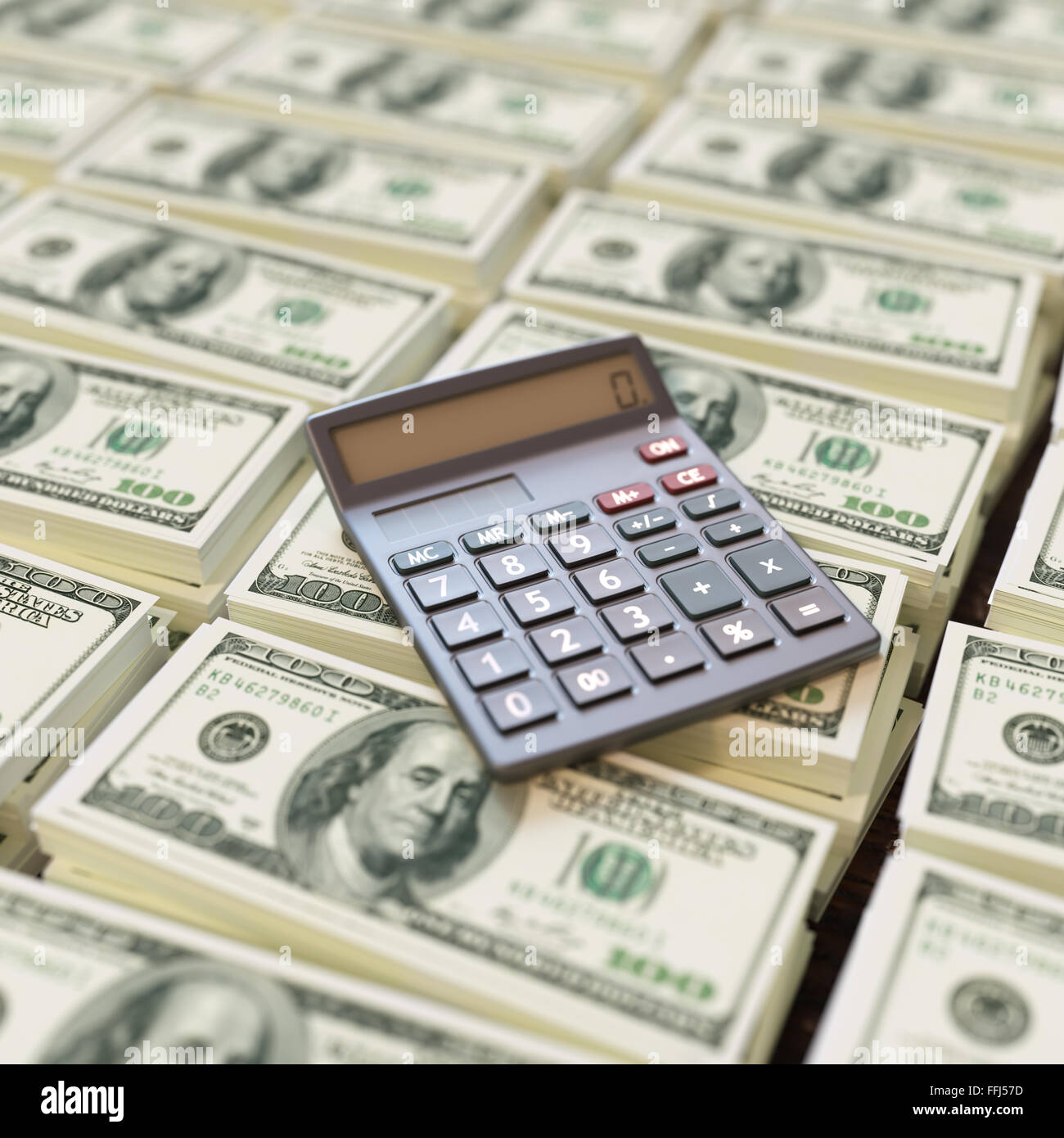 Calculator on 100 dollar banknotes Stock Photo - Alamy