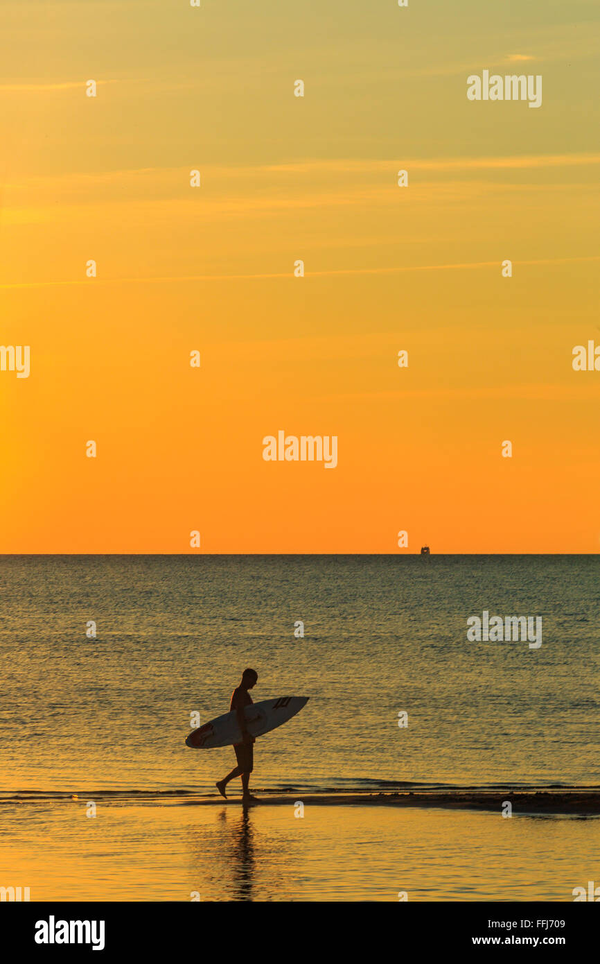 Man Surfing sunset Stock Photo - Alamy