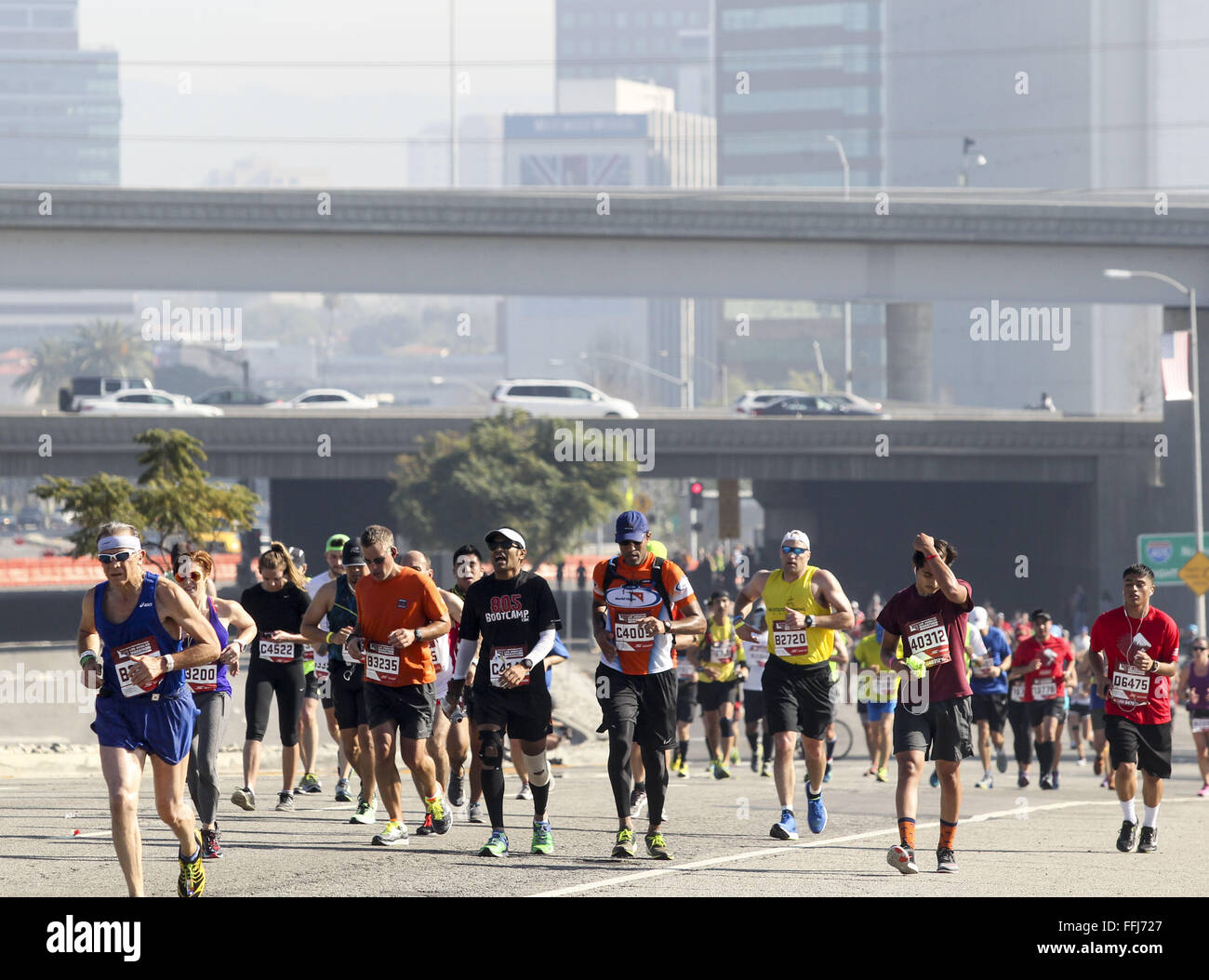 Los Angeles, California, USA. 14th Feb, 2016. Runners make their way ...