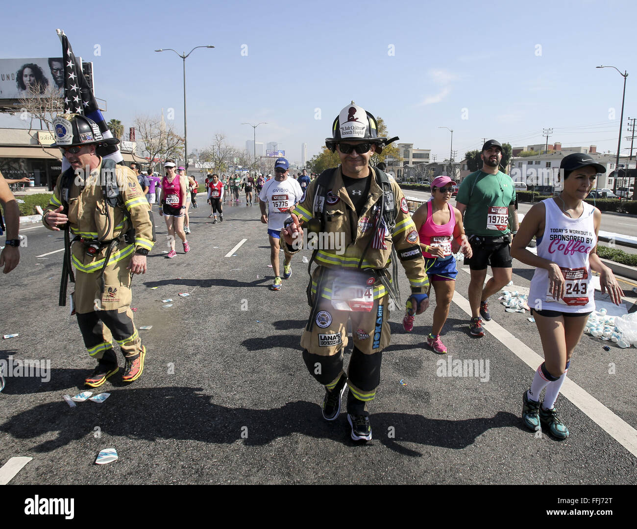 Los Angeles, California, USA. 14th Feb, 2016. Runners make their way ...