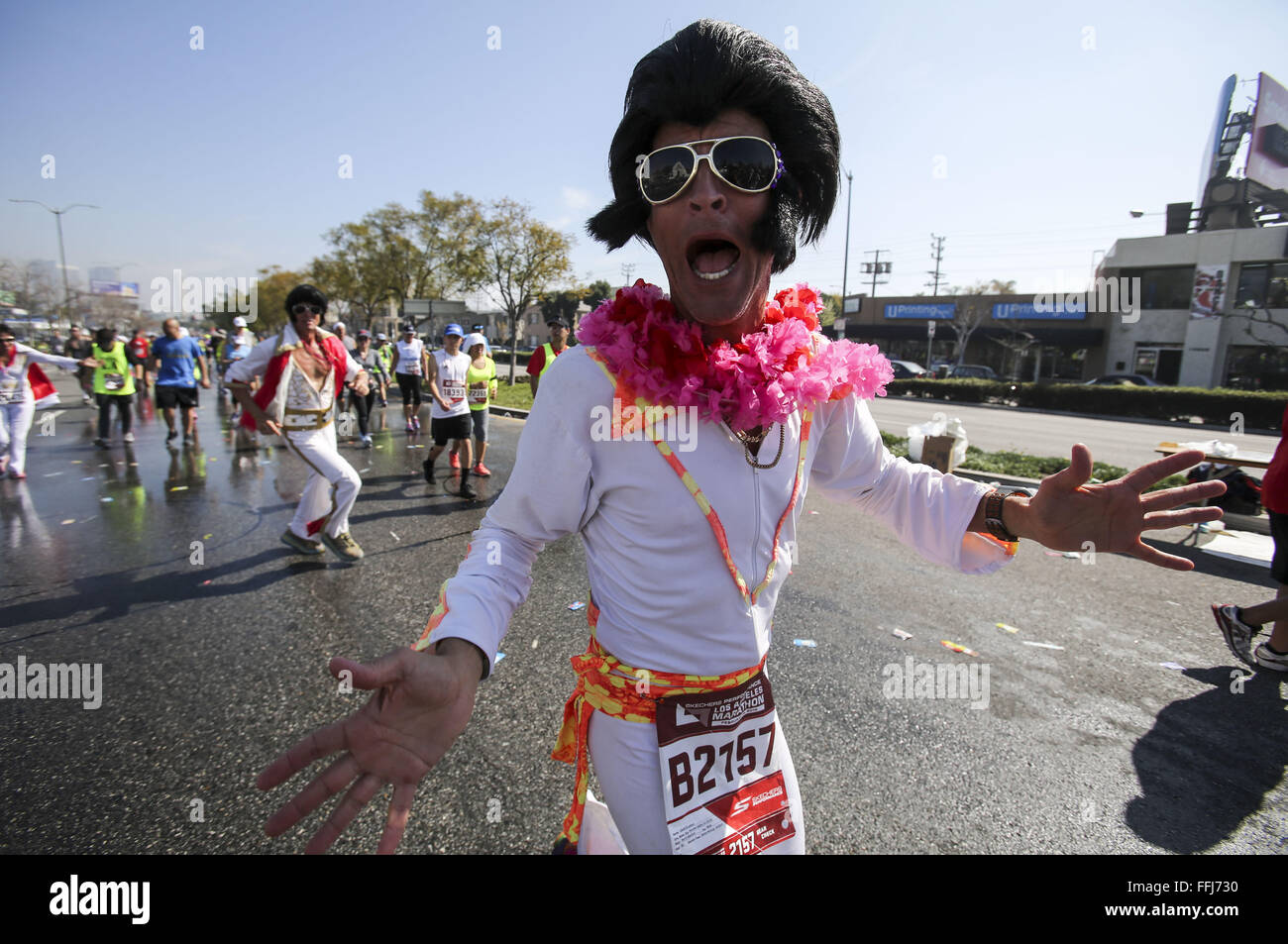Los Angeles, California, USA. 14th Feb, 2016. Runners make their way ...