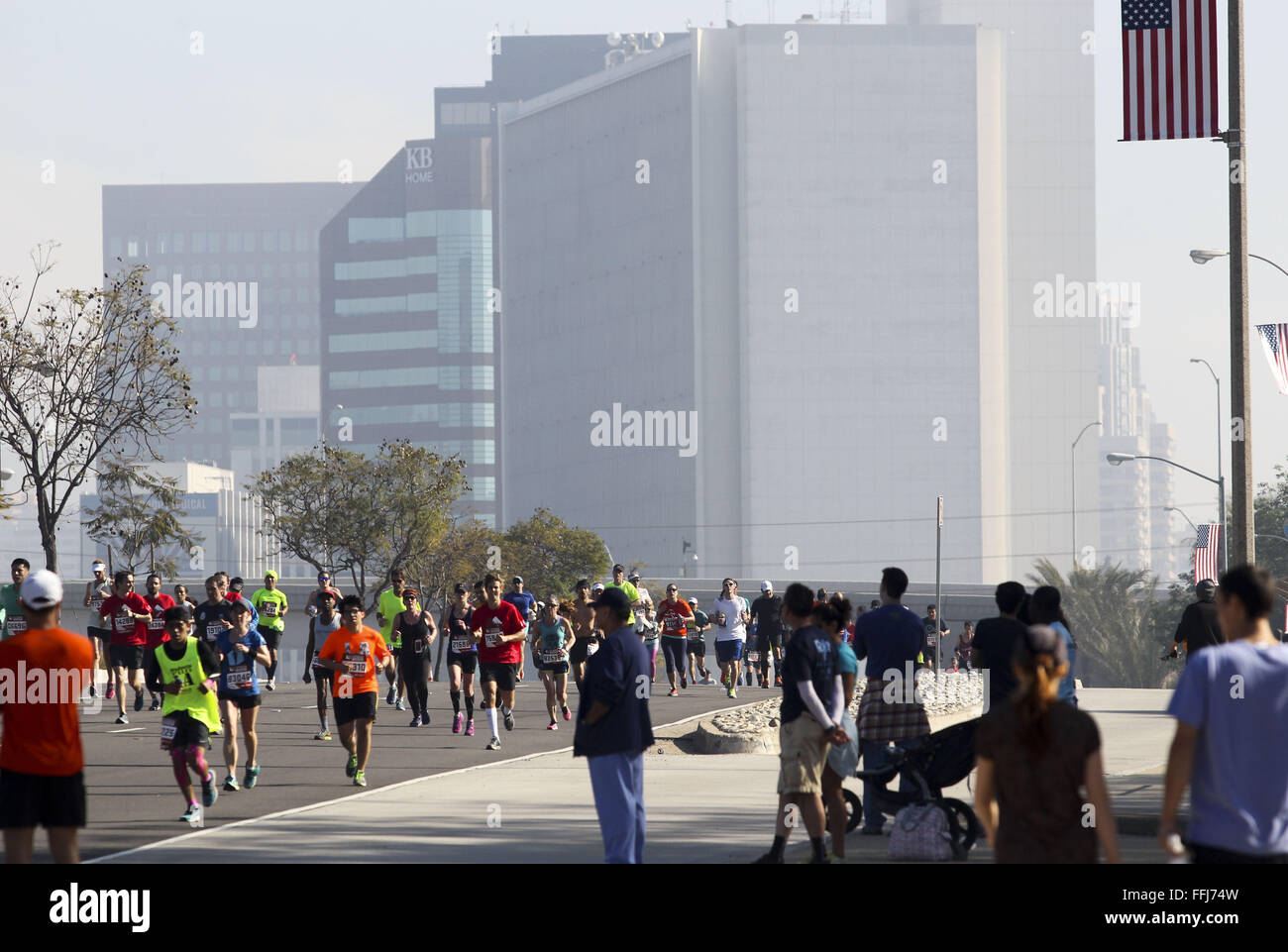 Los Angeles, California, USA. 14th Feb, 2016. Runners make their way ...