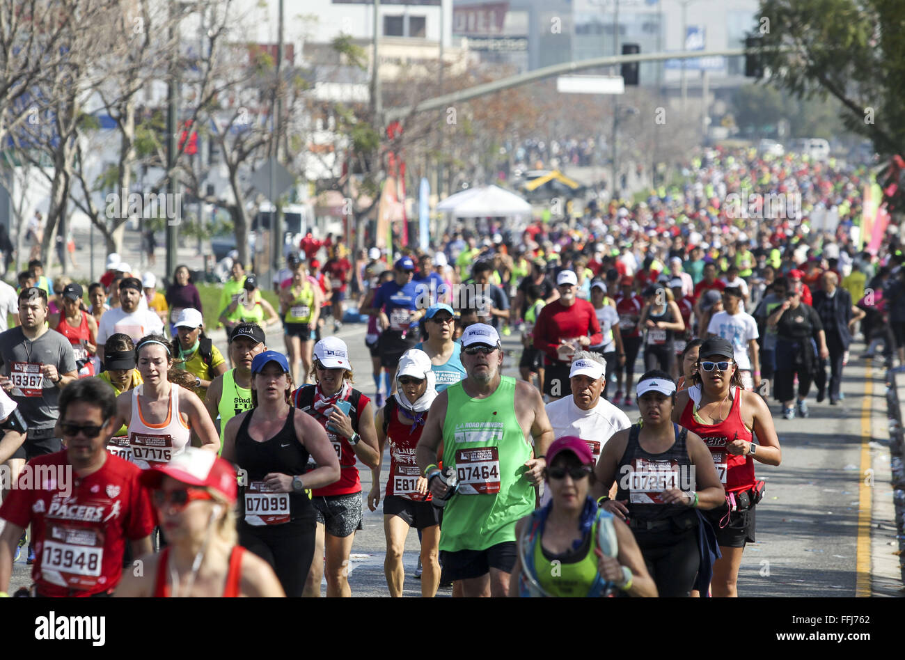 Los Angeles, California, USA. 14th Feb, 2016. Runners make their way ...