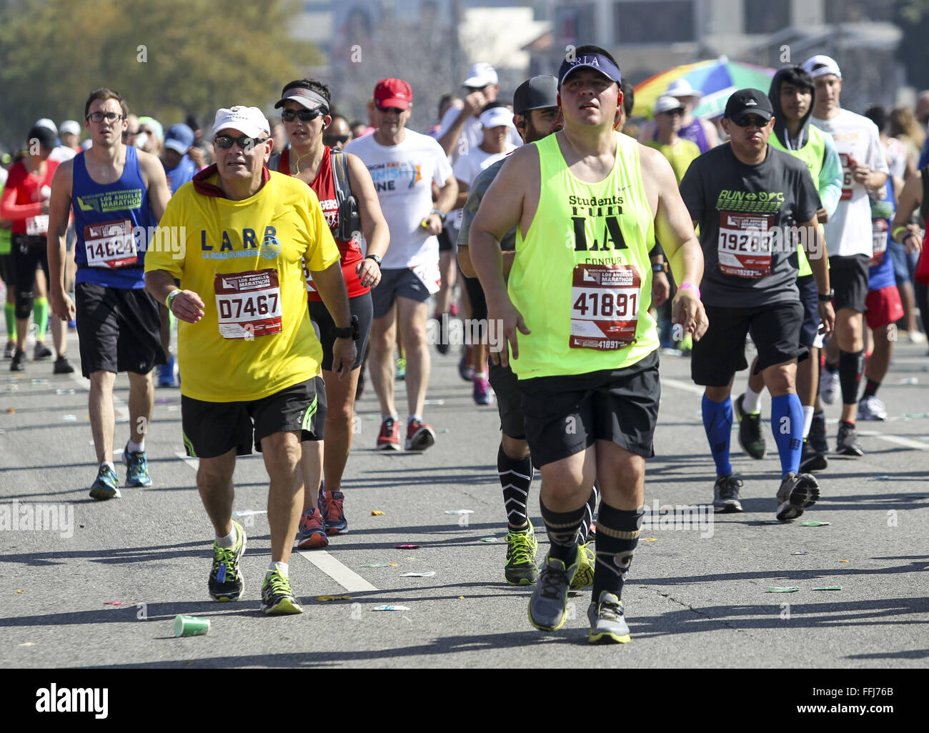 Los Angeles, California, USA. 14th Feb, 2016. Runners make their way ...