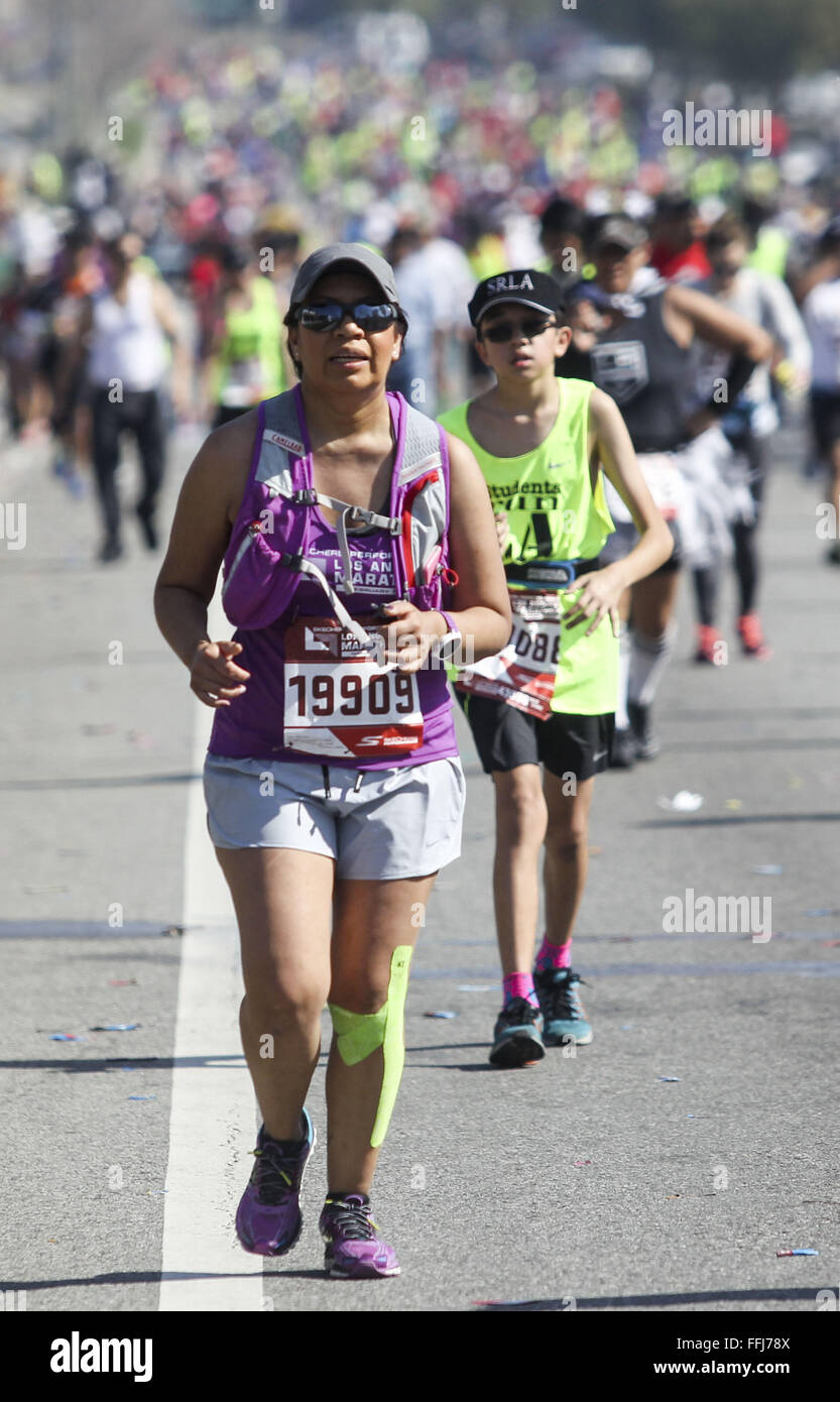 Los Angeles, California, USA. 14th Feb, 2016. Runners make their way ...