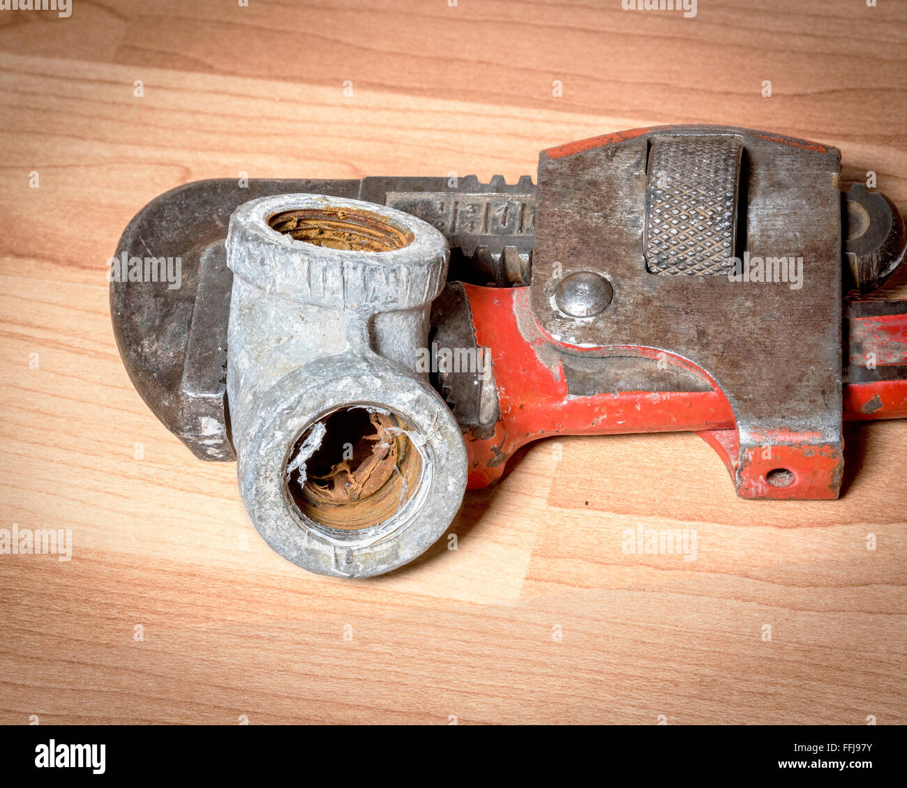 Corroded pipe elbow in a wrench Stock Photo - Alamy