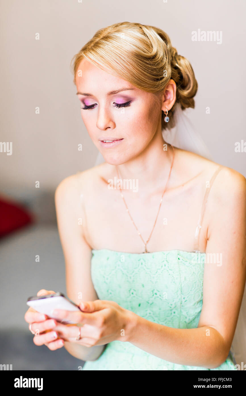Beautiful girl playing mobile phone Stock Photo - Alamy