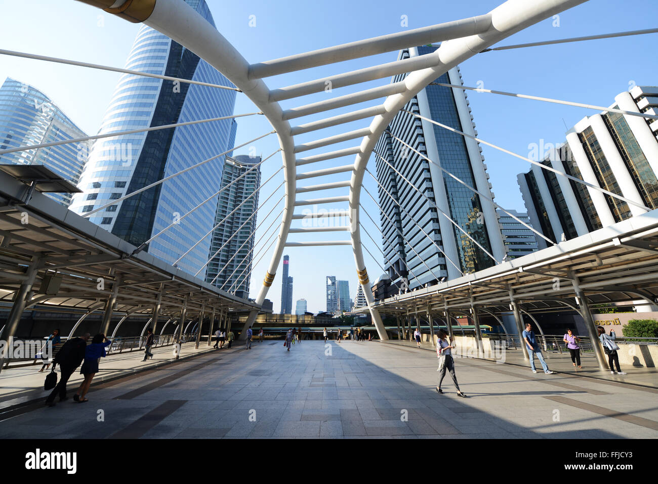 A modern pedestrian bridge crossing Sathorn Rd. near Chong Nonsi BTS ...