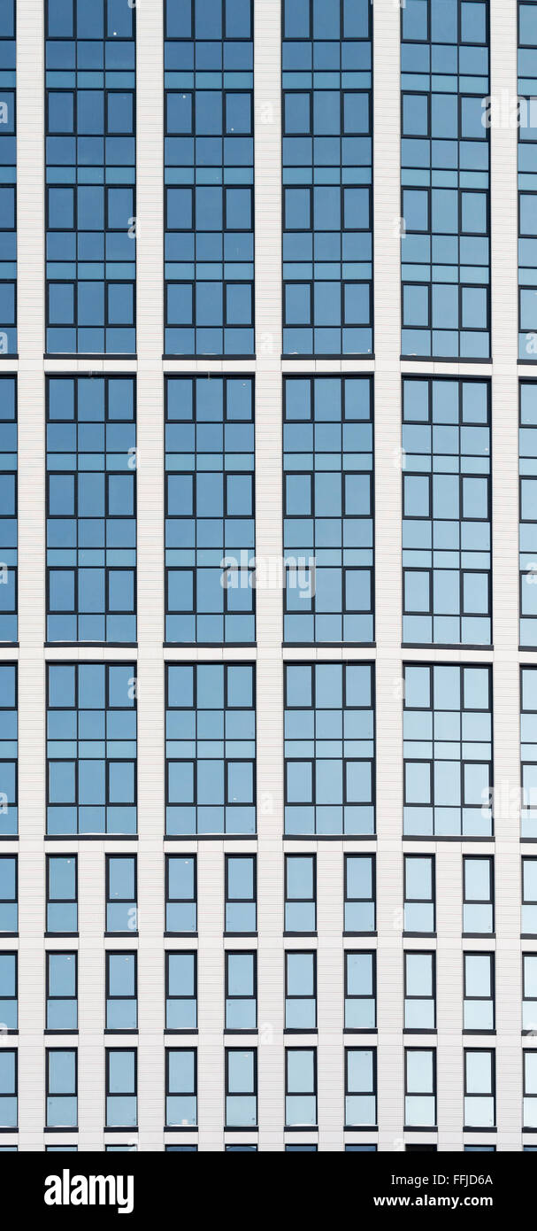 Modern glass high-rise office building with acute angles showing ...