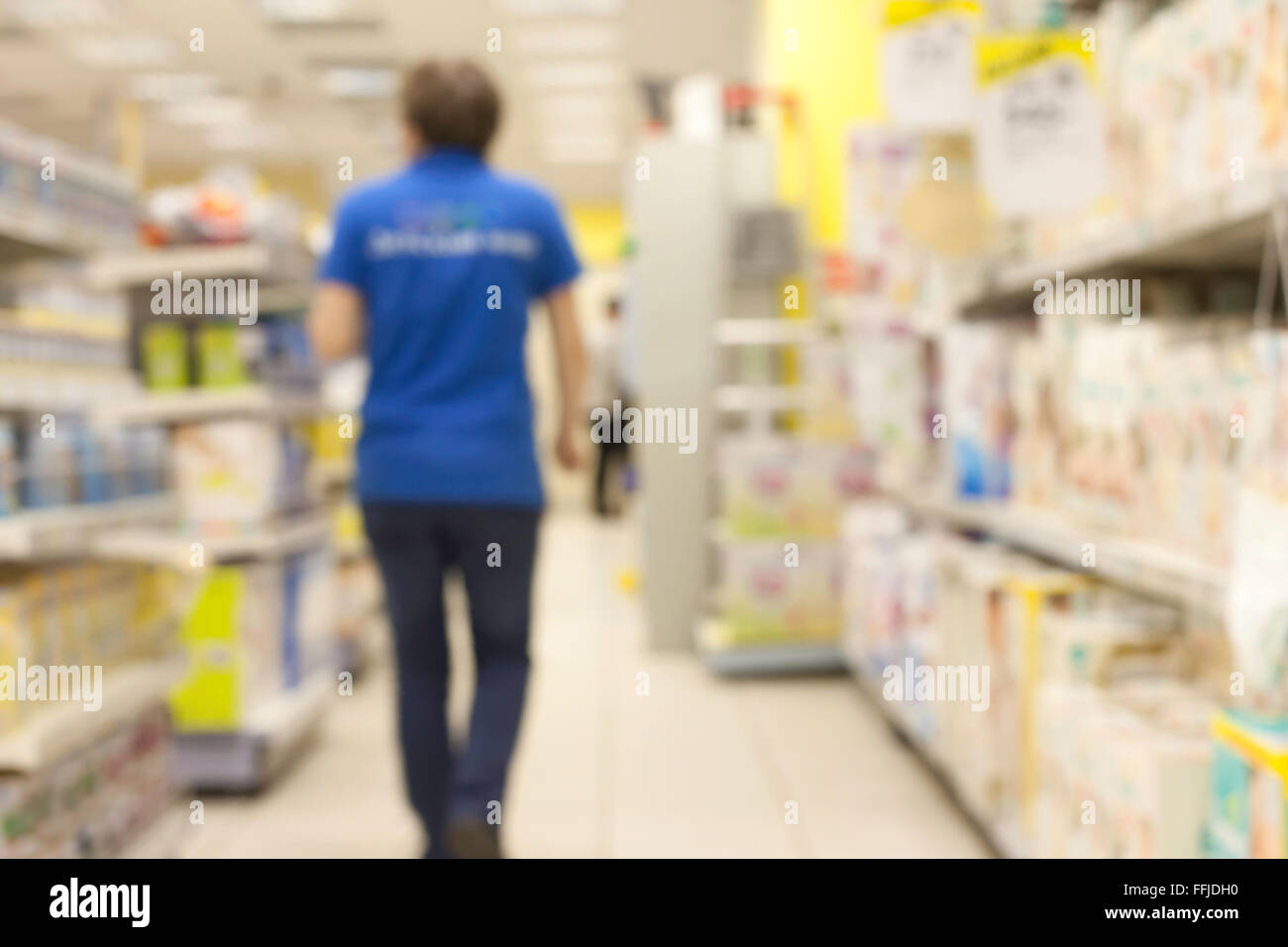blurred image shopping mall figure of seller Stock Photo - Alamy