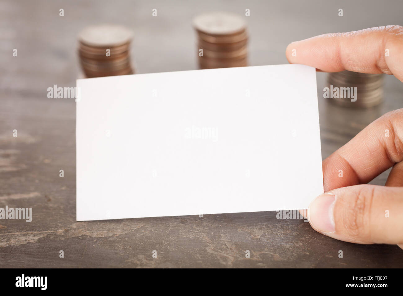 Blank name card with coins, stock photo Stock Photo - Alamy