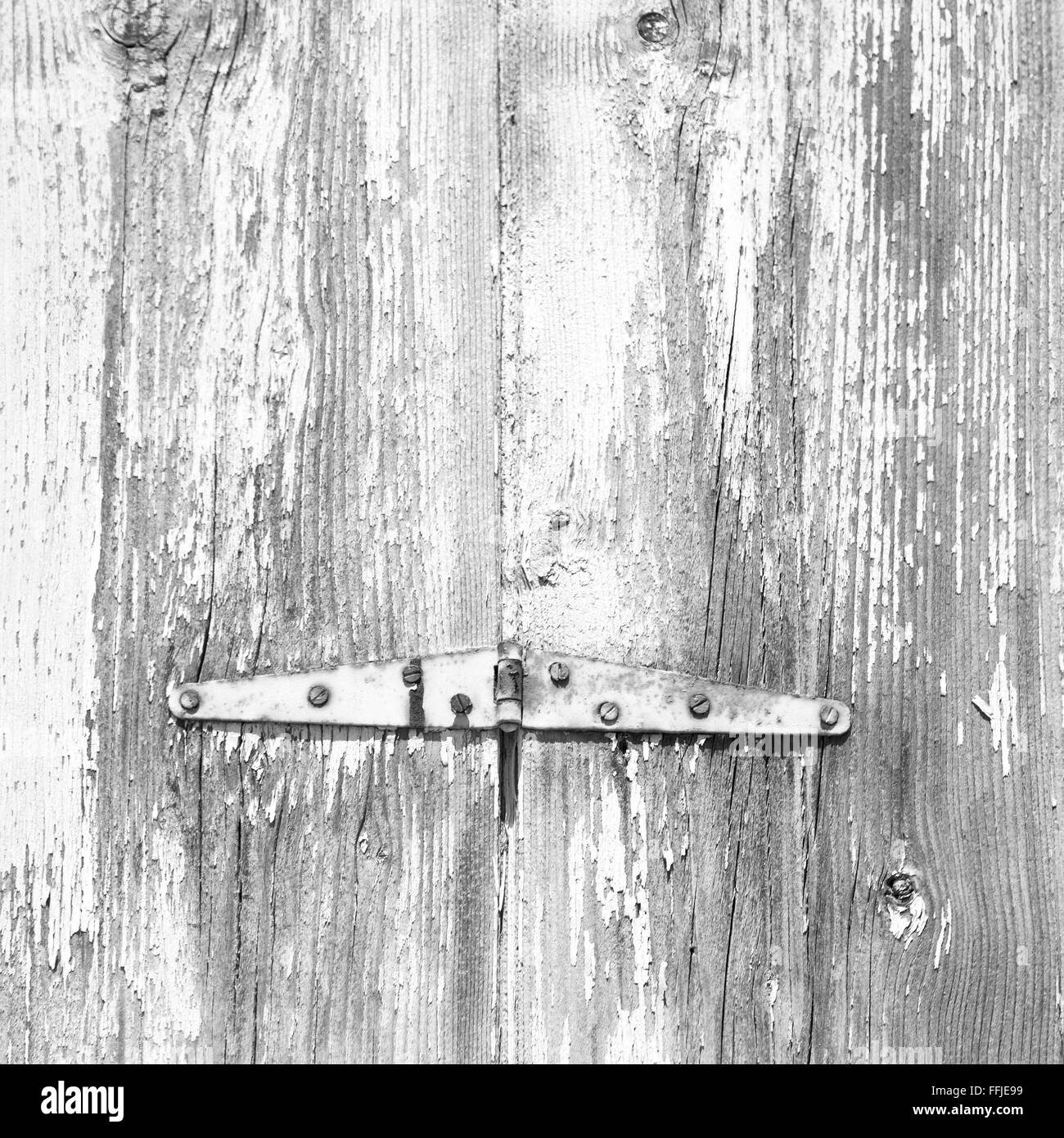 in the old wall a hinged window green wood and rusty metal Stock Photo ...