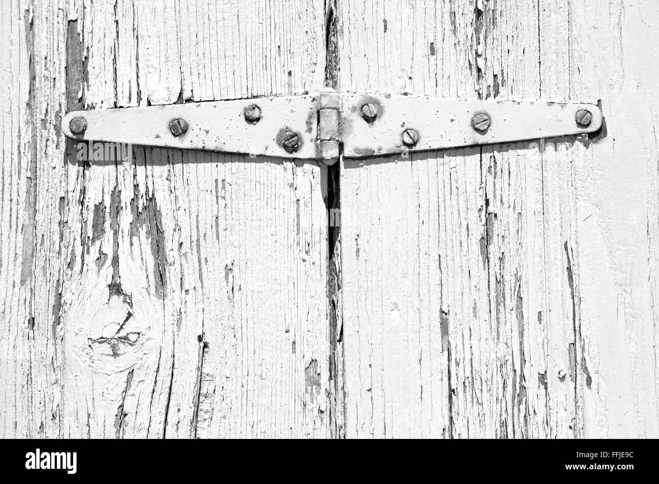 in the old wall a hinged window green wood and rusty metal Stock Photo ...