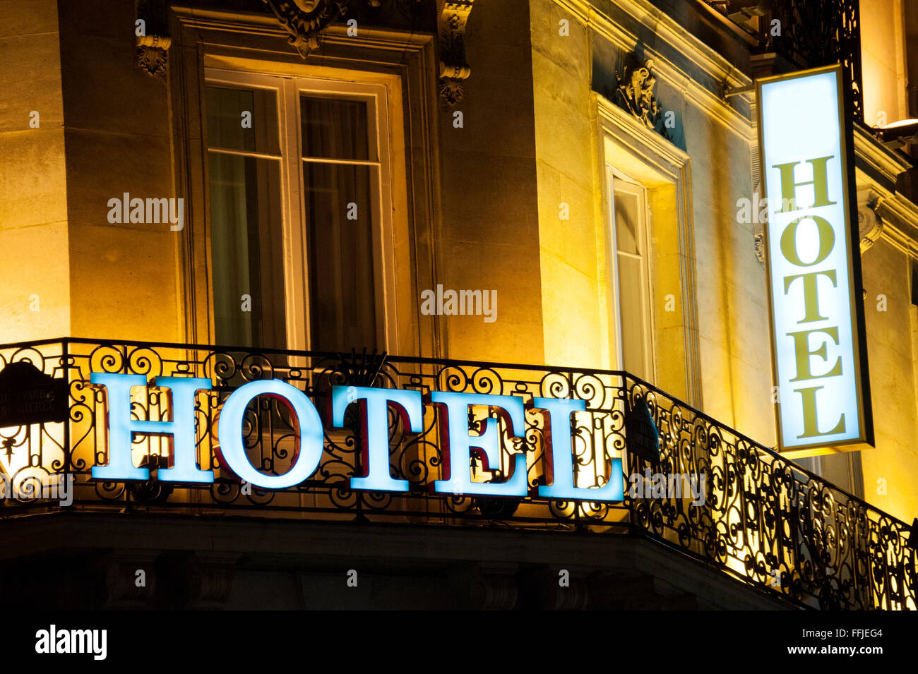 Illuminated hotel sign in Paris, at the dusk Stock Photo - Alamy